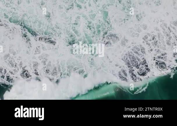 Foamy ocean water splashing super slow motion. Aerial view stunning ...