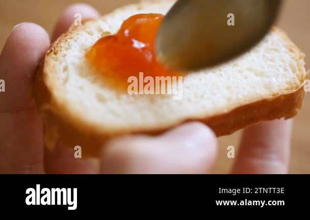 Jam bread spreading Stock Videos & Footage - HD and 4K Video Clips - Alamy