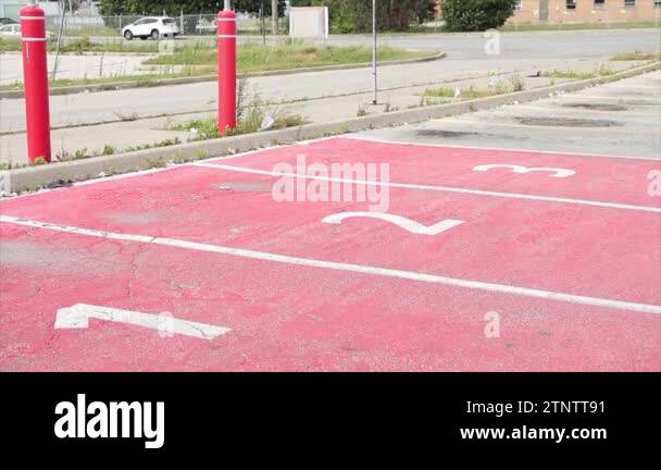 three red parking spots spaces with numbers 1 2 3 in each of them side ...