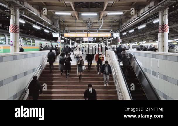 Tokyo, Japan - Dec 6,2022: Busy crowd Japanese people walk, wait, board ...