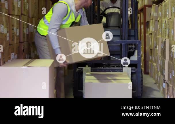 Animation of connected profile icons over caucasian man loading boxes ...
