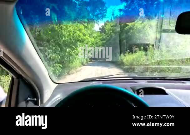 driving in a car on a bad road. travel by car. view from the driver's ...