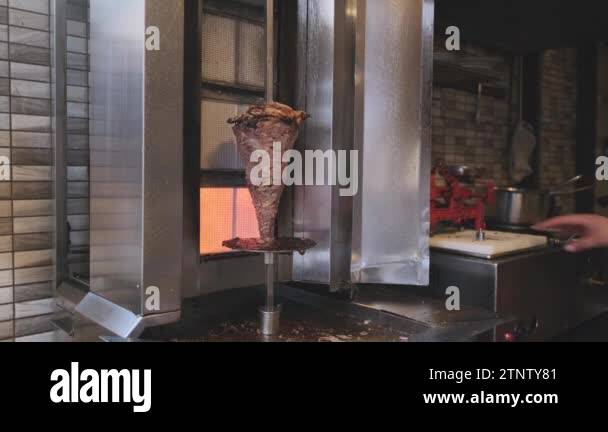 Turkish doner, Meat doner cut close-up videos, cutting hanging doner ...