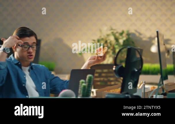 Laughing men lunch break time in office closeup. Hungry designers ...