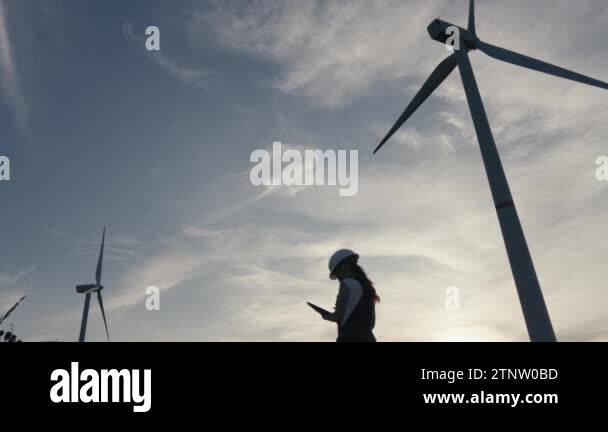 The young female engineer uses her skills and knowledge to optimize ...