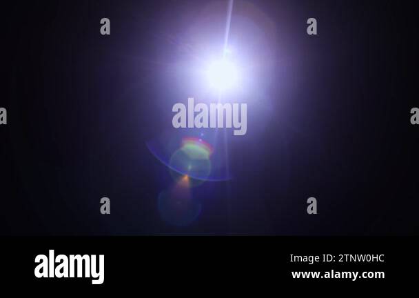 Glare on a black background. A camera pointed at the light produces a ...