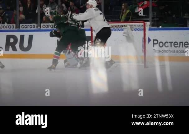 ALMATY, KAZAKHSTAN - MARCH 27 2023: Hockey players compete fiercely to ...