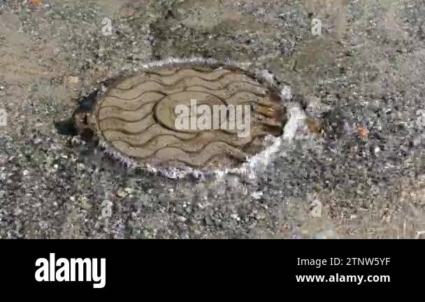 Outflow of water from the aqueduct. Breakthrough of the water supply ...