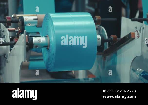 Factory Winds a Roll of Blue Polyethylene into Fabric during the ...
