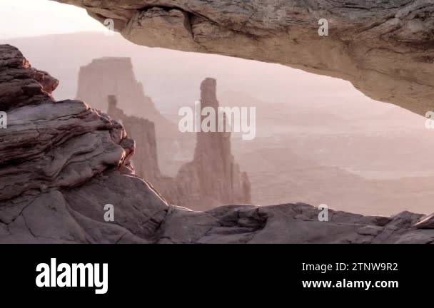 Rock Opening to Desert Landscape Camera Pan 4K features a view of the ...