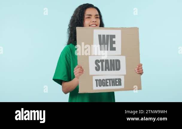 Poster, protest for unity or solidarity and a woman in studio on a blue ...