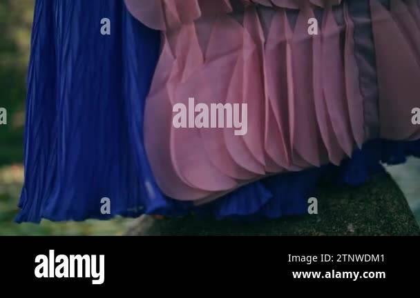 Closeup bare woman legs stand up on natural stone at forest lake ...