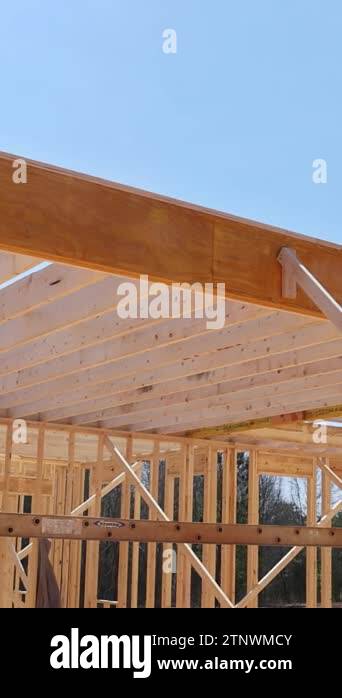 Support beams beams roof construction at new house construction using ...