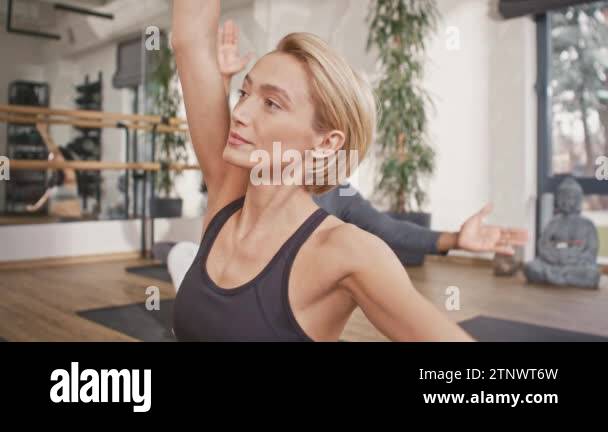 Beautiful female meditation couch teaching her clients relaxation ...