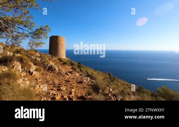 Mediterranean coastal landscape. Historic Torre Vigia De Cerro Gordo, a ...