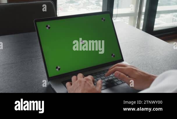 Close up business man working in office on laptop on desk, looking at ...