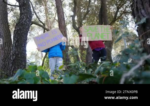 volunteer kids with Save the planet Poster. boy child activist holding ...