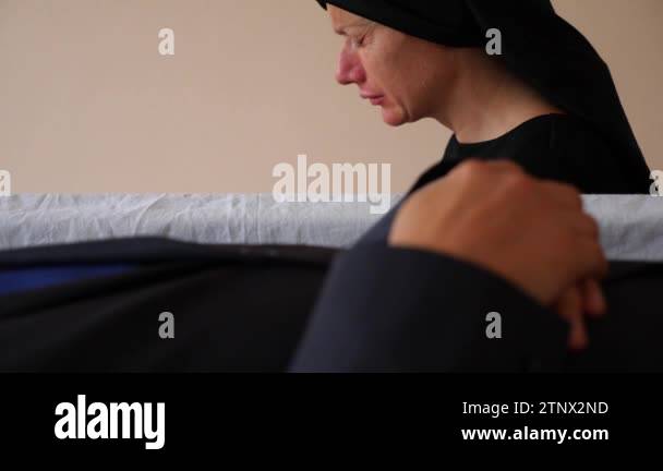 funeral, sadness and mourning concept - sad woman talking and crying ...