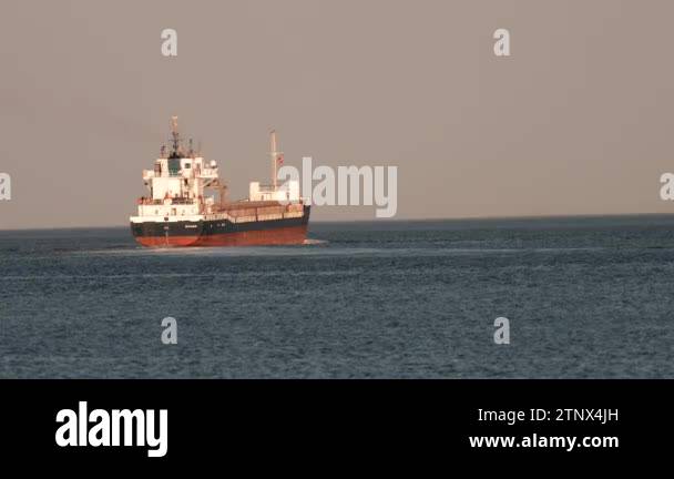 A containerized cargo ship enters the port for unloading. Big container ...