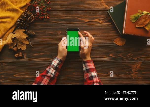 Woman scrolling tapping,zooming touchscreen on black smart phone with ...