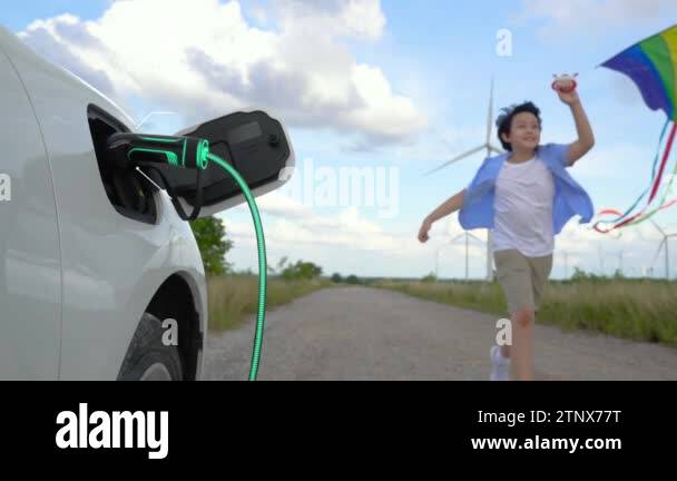 Focus EV car recharging display battery status hologram, charging station using eco-friendly ...