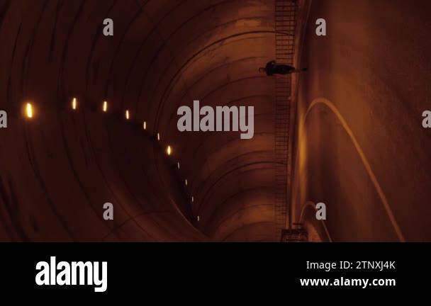 Running sports activity. Man running fast through tunnel. Vertical ...