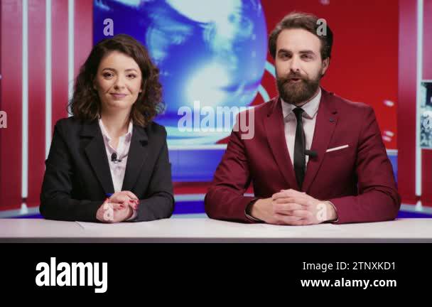 Morning show presenters hosting newscast live on television, presenting ...