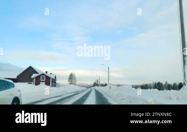 Driving on snow-covered road in 4K time-lapse. Clear sky horizon ...