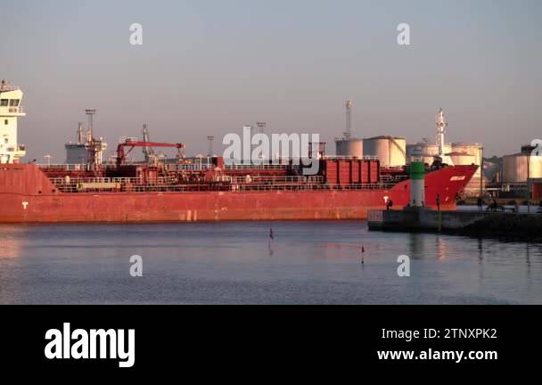 A containerized cargo ship enters the port for unloading. Big container ...