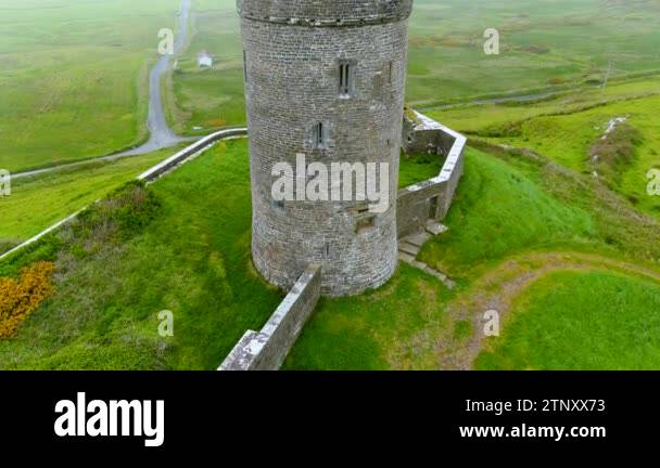 Doonagore Castle aerial foggy view, iconic landmark, one of the most ...