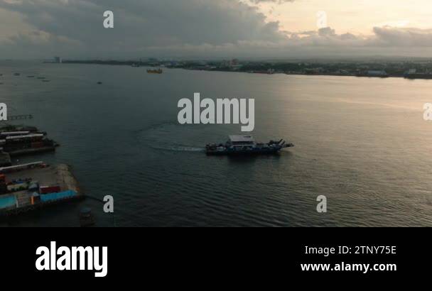 A ferry boat going to other island from tropical port. Samal Island ...