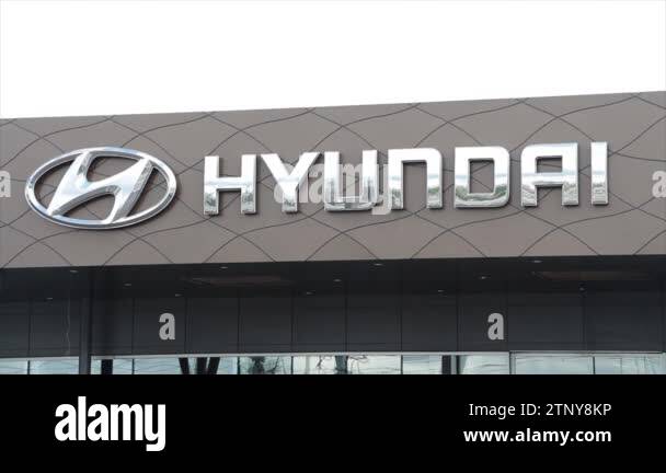 hyundai silver logo sign writing caption text on gray dealership front ...