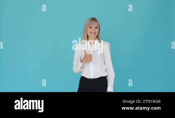 Contented Caucasian woman is seen giving a thumbs-up gesture on a ...