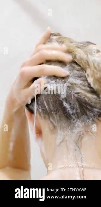 Woman Washing Her Hair With Shampoo In Shower Back View Showering Long
