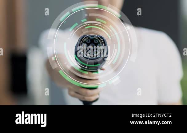 Focus EV charger pointing in front of camera display futuristic eco ...