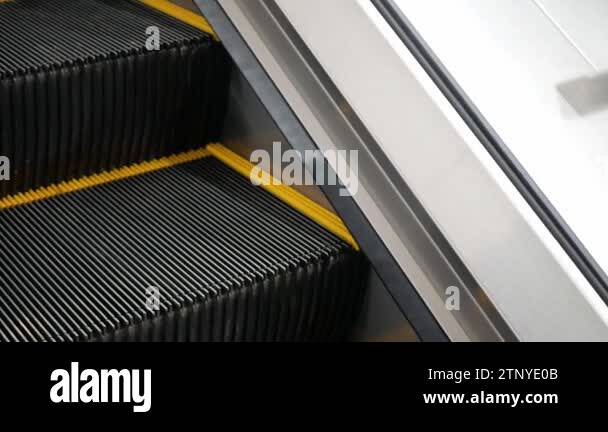 close up view to stair on moving up escalator in subway metro station ...
