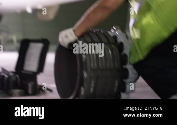 Calm workers controlling aircraft machine and chassis. Aircraft ...