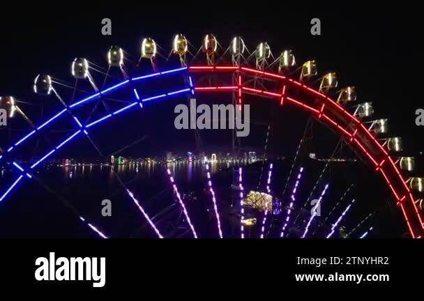 Top view aerial of ferris wheel in amusement park at night. Ferris ...