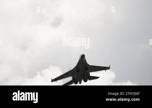 Footage of combat fighter jet flying overhead. Military aviation in the ...