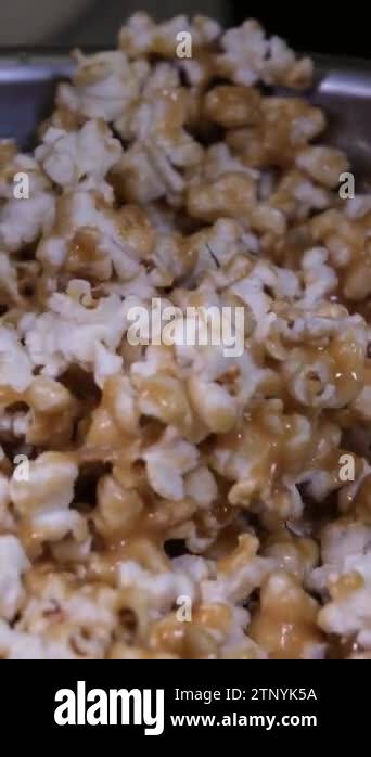 Cooking Popcorn popping on heated fry pan. Slow Motion. Making Popcorn ...