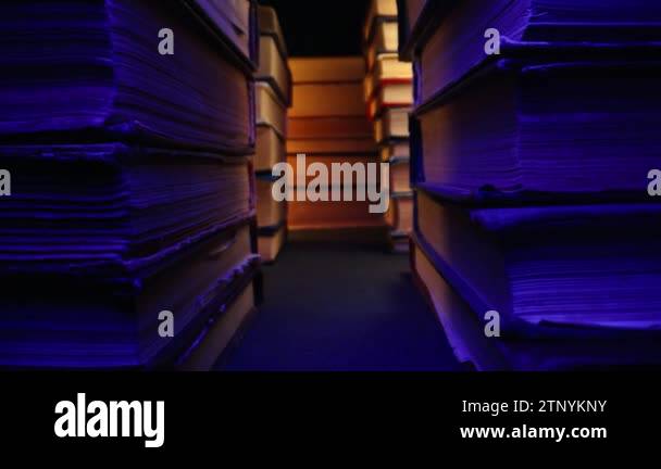 Library stack of old books, slider macro footage, camera moving between ...