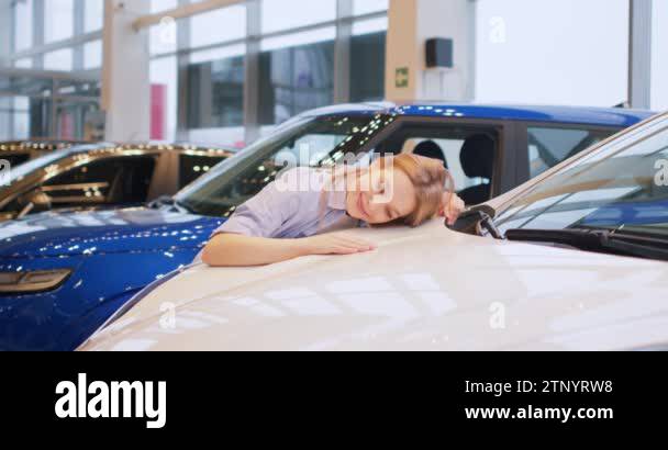 Young beautiful woman hugging bought car, Happy girl hugging new car ...