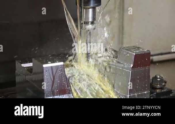Slow motion scene of CNC milling machine cutting the tire mold parts ...