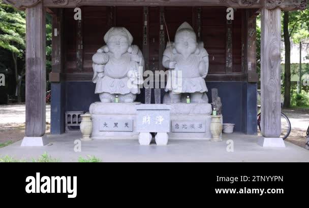 Japanese guardian statues at the traditional street in Tokyo. High ...