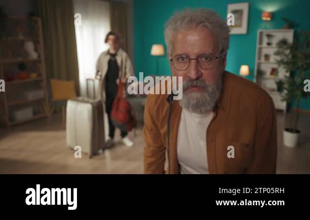 Video of a teenager, young man with his grandfather, granddad posing at ...