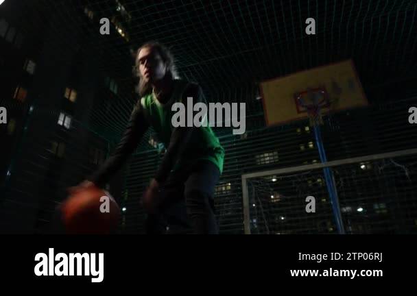 Bottom view portrait of positive young Caucasian sportsman bouncing ...