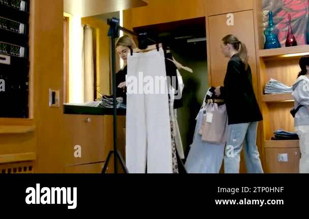 aritzia shopping for clothes stress relief girls choosing clothes in a store shopping joy luck ...