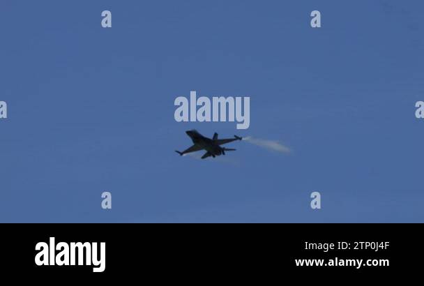 Fighter jet performs high angle of attack AoA maneuver over green ...