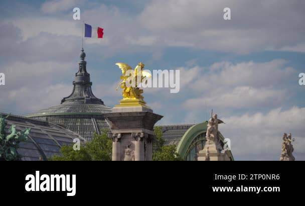 Grand Palais with french flag. Alexander Bridge in Paris with golden ...