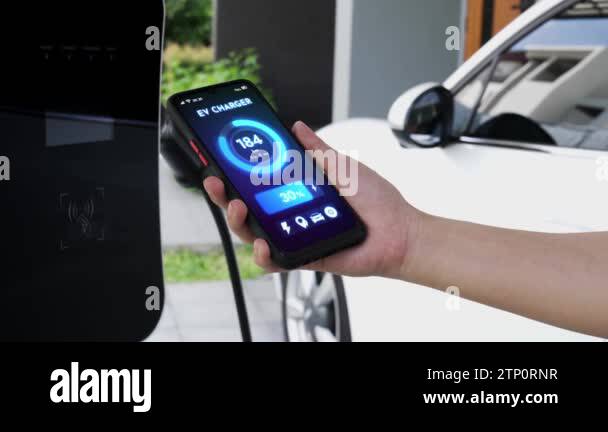 Smartphone display battery status on smart EV mobile application while ...